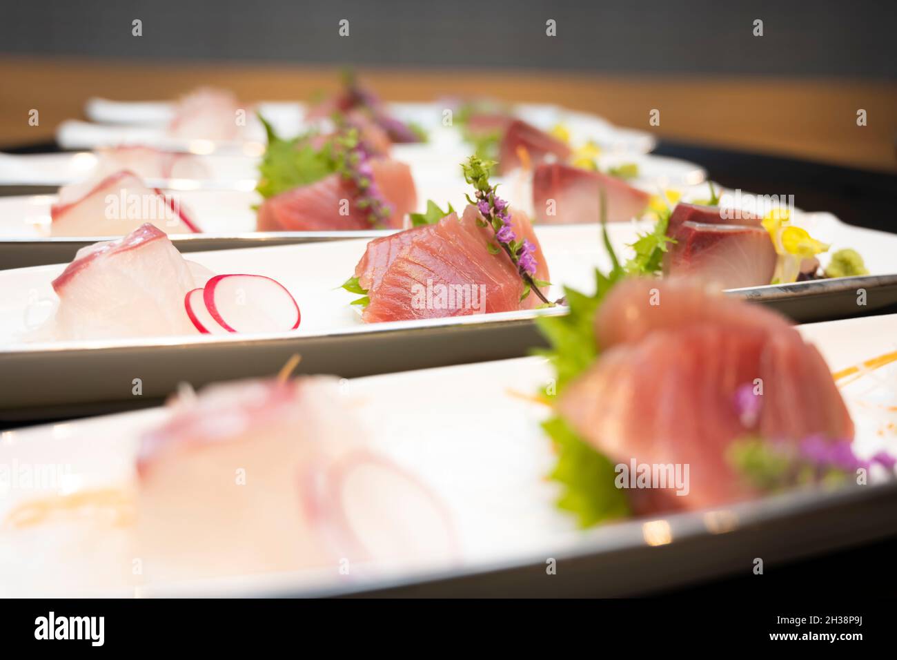 Thai, tuna, yellowtail sashimi with plenty of wasabi Stock Photo - Alamy