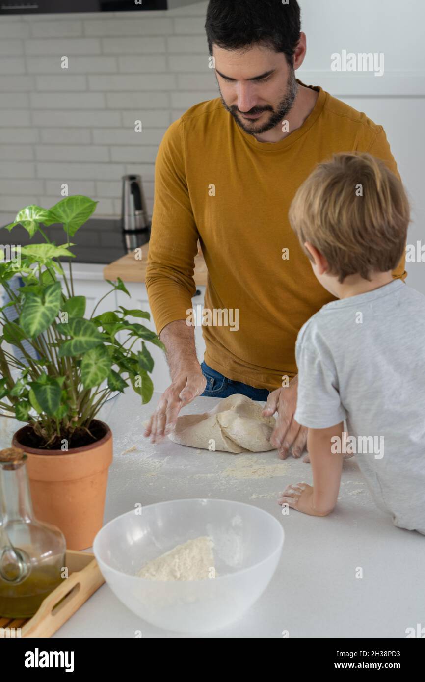 Father and son making bread hi-res stock photography and images - Alamy