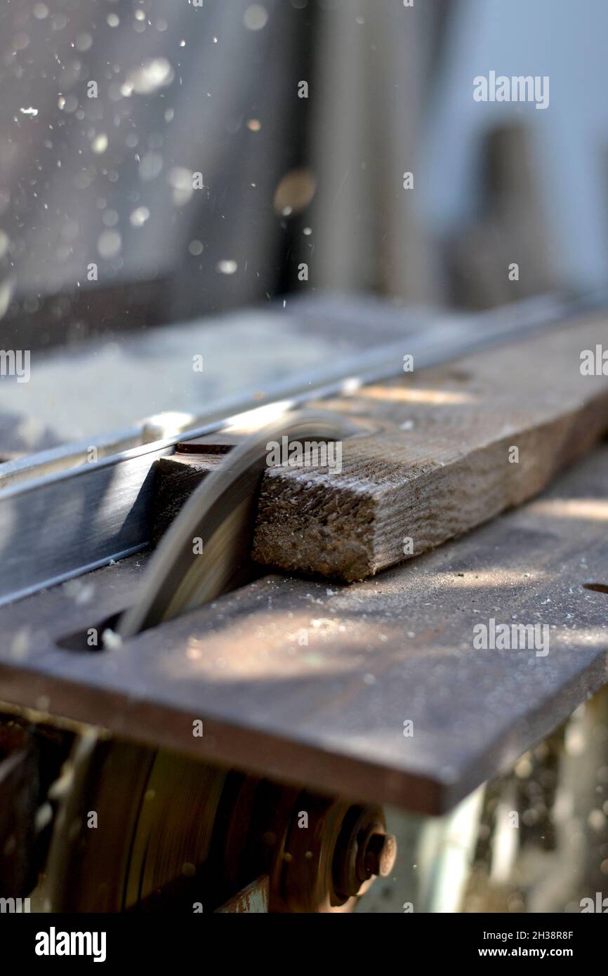 Saw cutting wood close up picture Stock Photo - Alamy