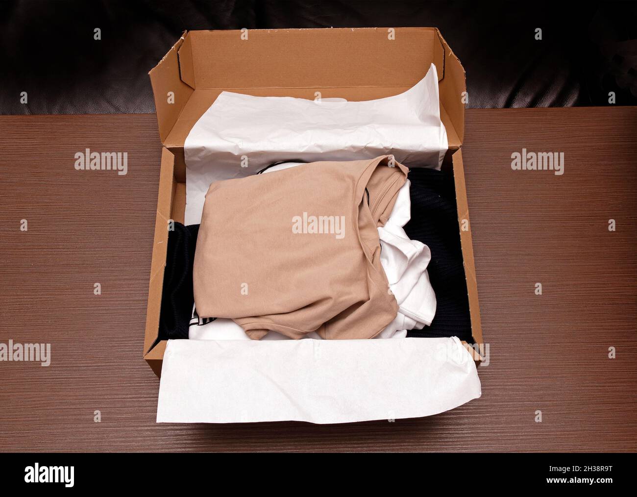 Delivered clothes package hi-res stock photography and images - Alamy