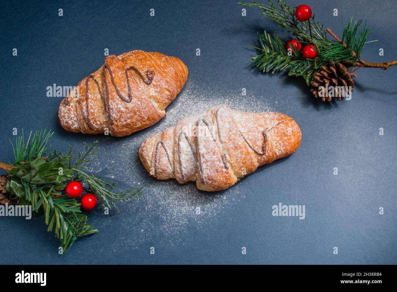 fresh christmas croissants on the blue background Stock Photo - Alamy