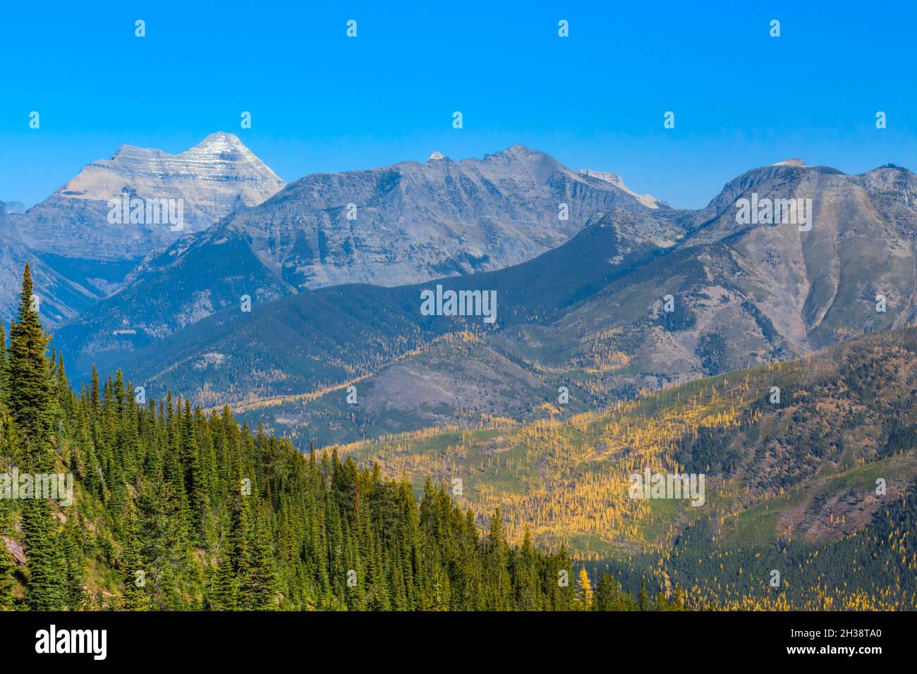 mount stimson and eaglehead mountain in glacier national park in autumn ...