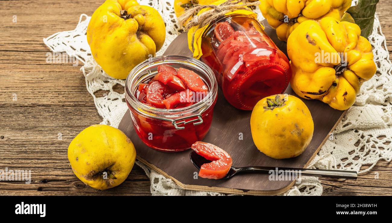 Homemade quince jam in a glass jar. Fresh fruits, sweet marmalade ...