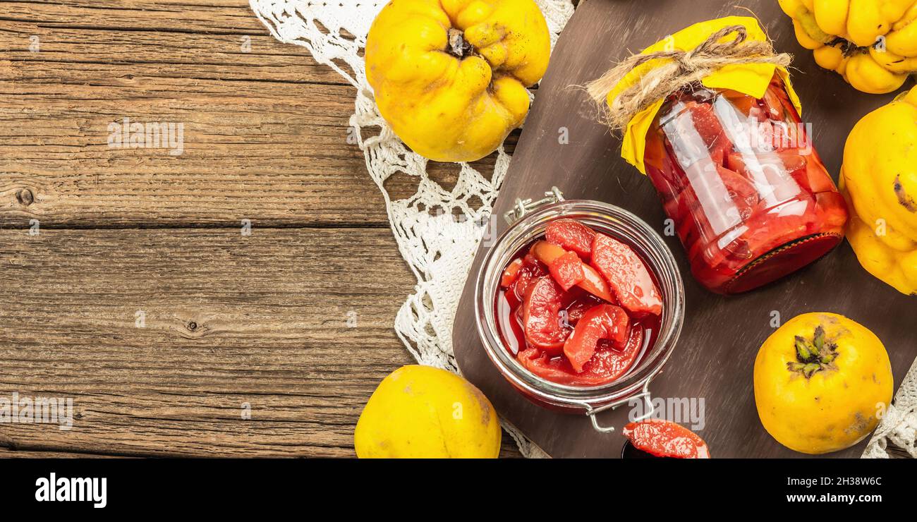 Homemade quince jam in a glass jar. Fresh fruits, sweet marmalade ...