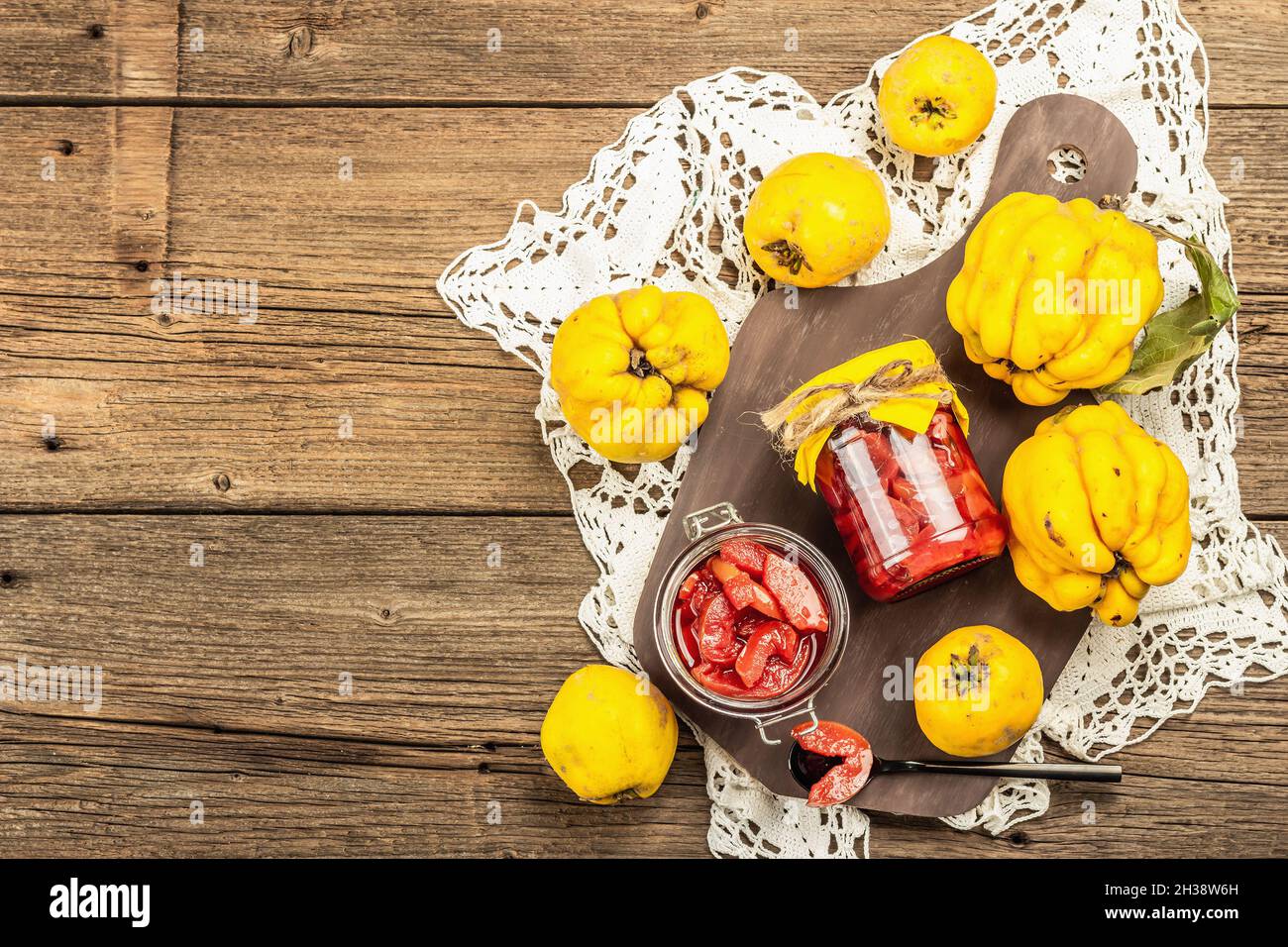 Homemade quince jam in a glass jar. Fresh fruits, sweet marmalade ...
