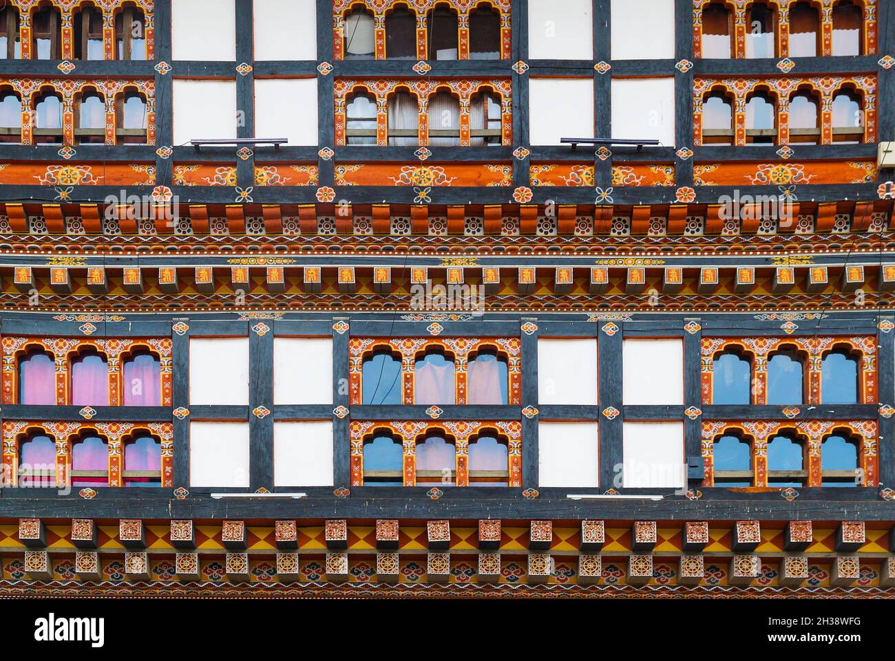Windows of traditional house in Bhutan Stock Photo - Alamy