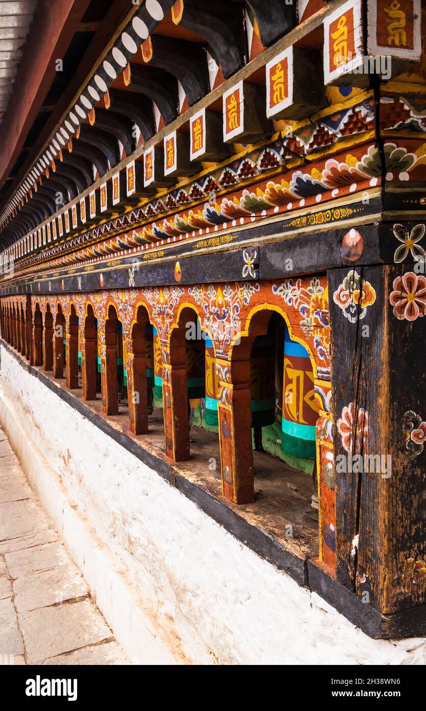 Turning prayer wheels mantra in Bhutan with traditional writing mantra ...