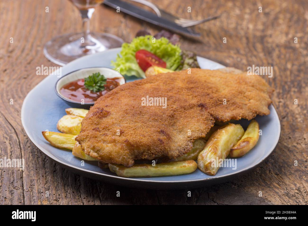 Wiener schnitzel with fries on a plate hi-res stock photography and ...