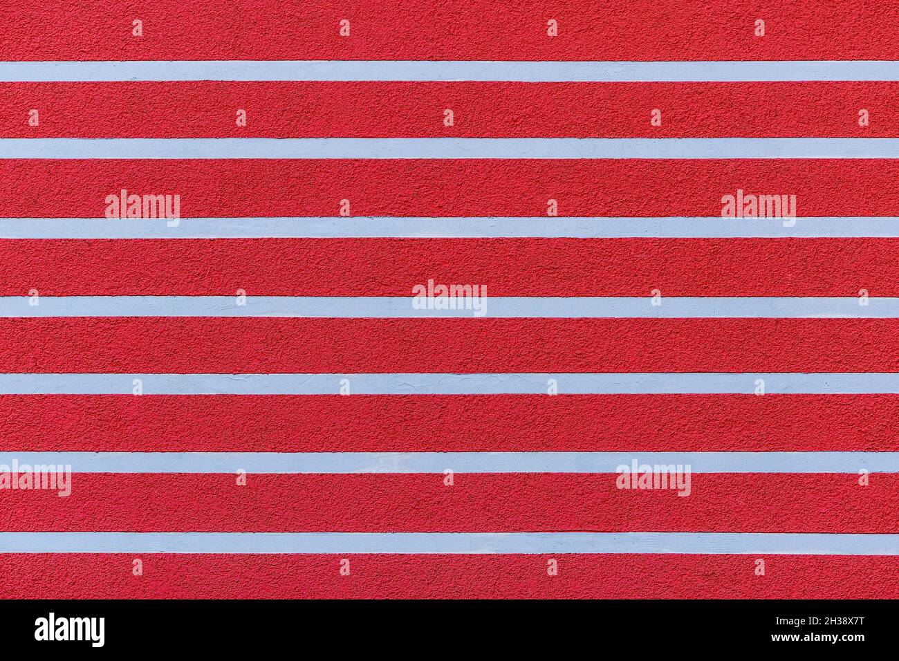 Red wall with a horizontal stripe pattern for wallpapers and background ...