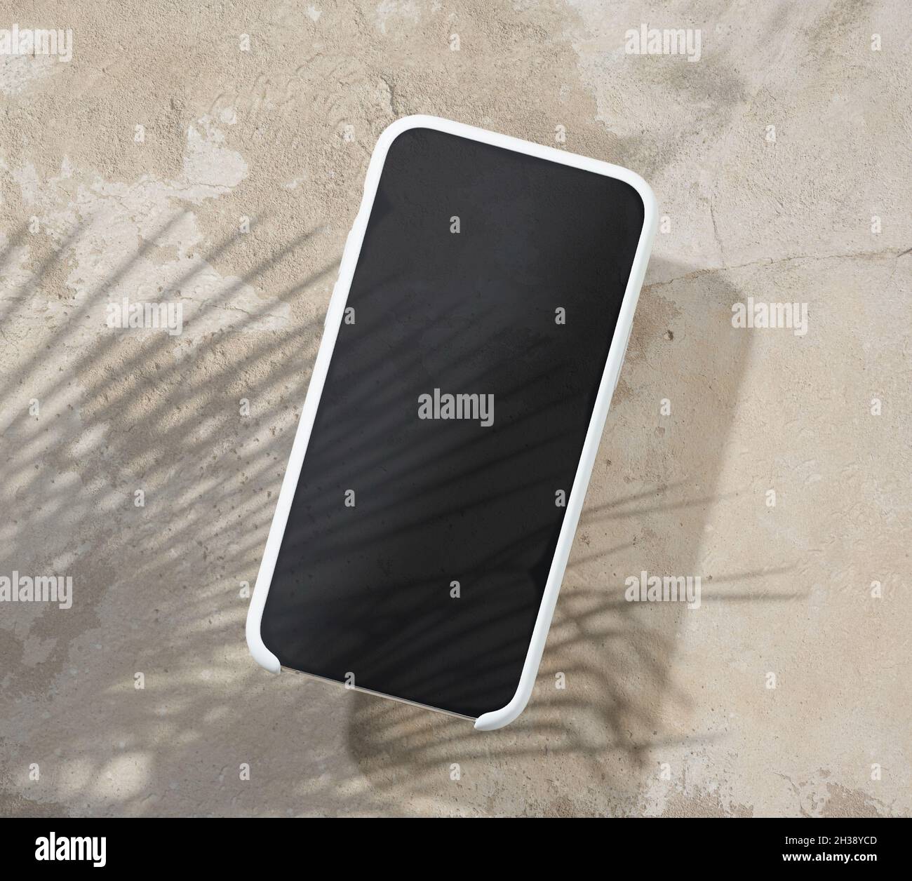 smartphone on beige color table top with palm leaf shadow, top view ...