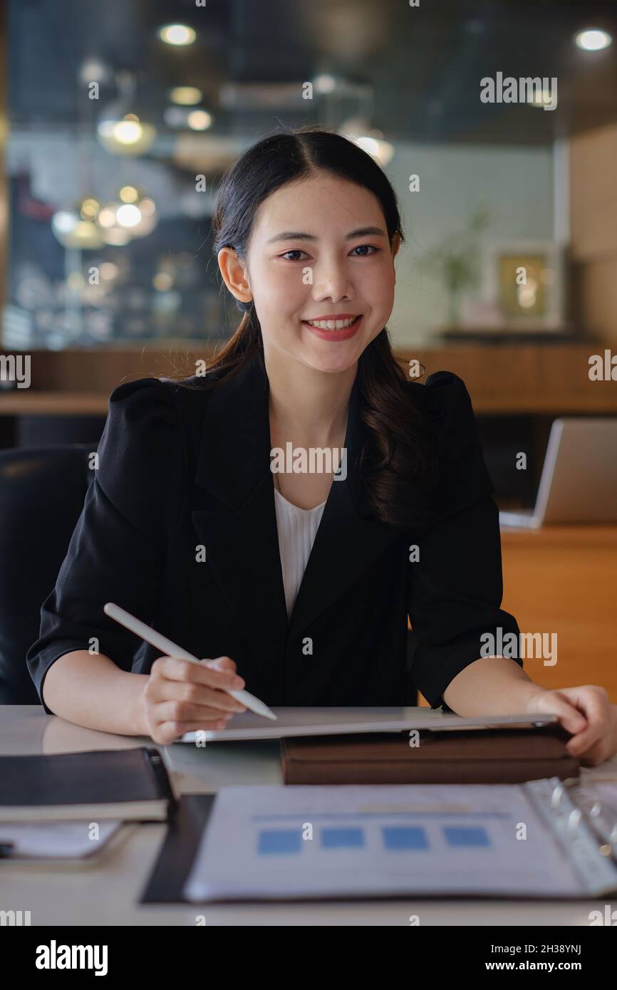Happy Business woman working to analyze technical price graph and ...