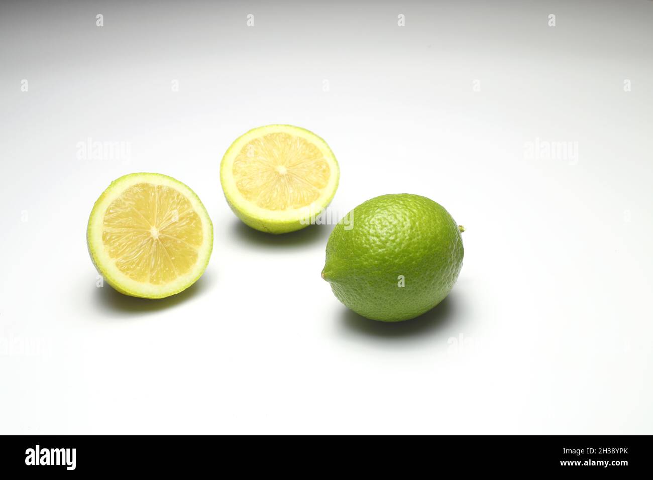 Whole Green Lemon , half and slice, isolate on white background with ...