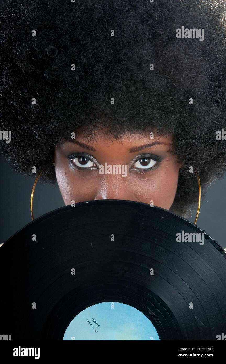African American female singer with one of her vintage looking vinyl ...