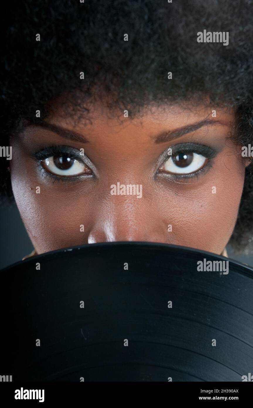 African American female singer with one of her vintage looking vinyl ...