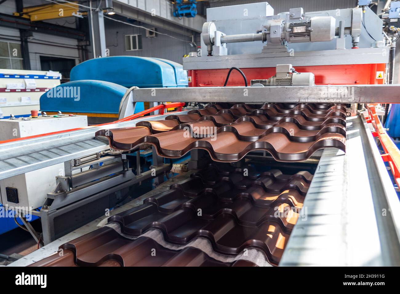 Process of forming Metal Tile close up in metalforming machine Stock ...