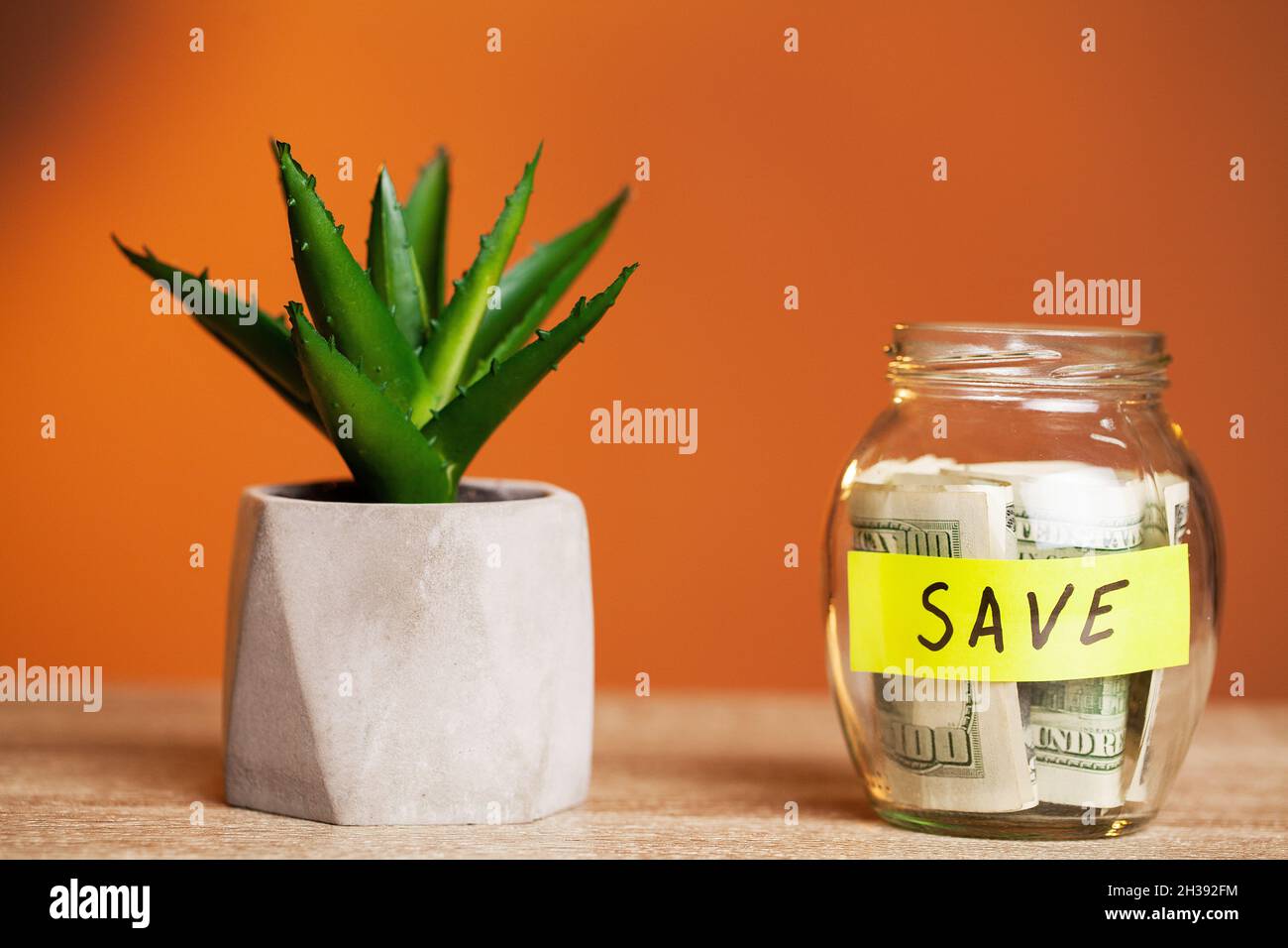 100 dollar bills jar hi-res stock photography and images - Alamy