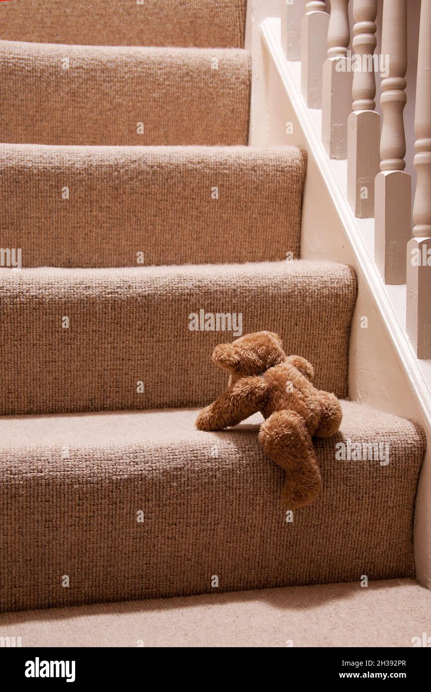 Cute Teddy bear climbing the stairs going to bed Stock Photo - Alamy