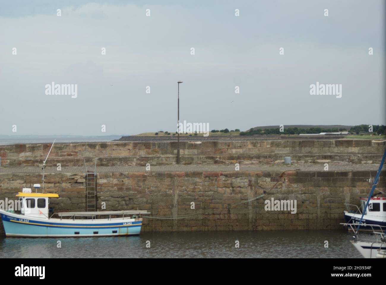 Musselburgh Harbour Showing A Small Fishing Boat Stock Photo - Alamy