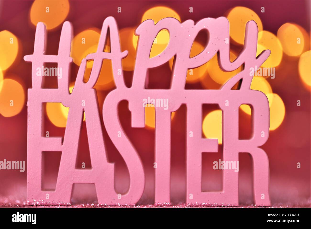 Happy easter. inscription Happy Easter in glitter with golden bokeh ...