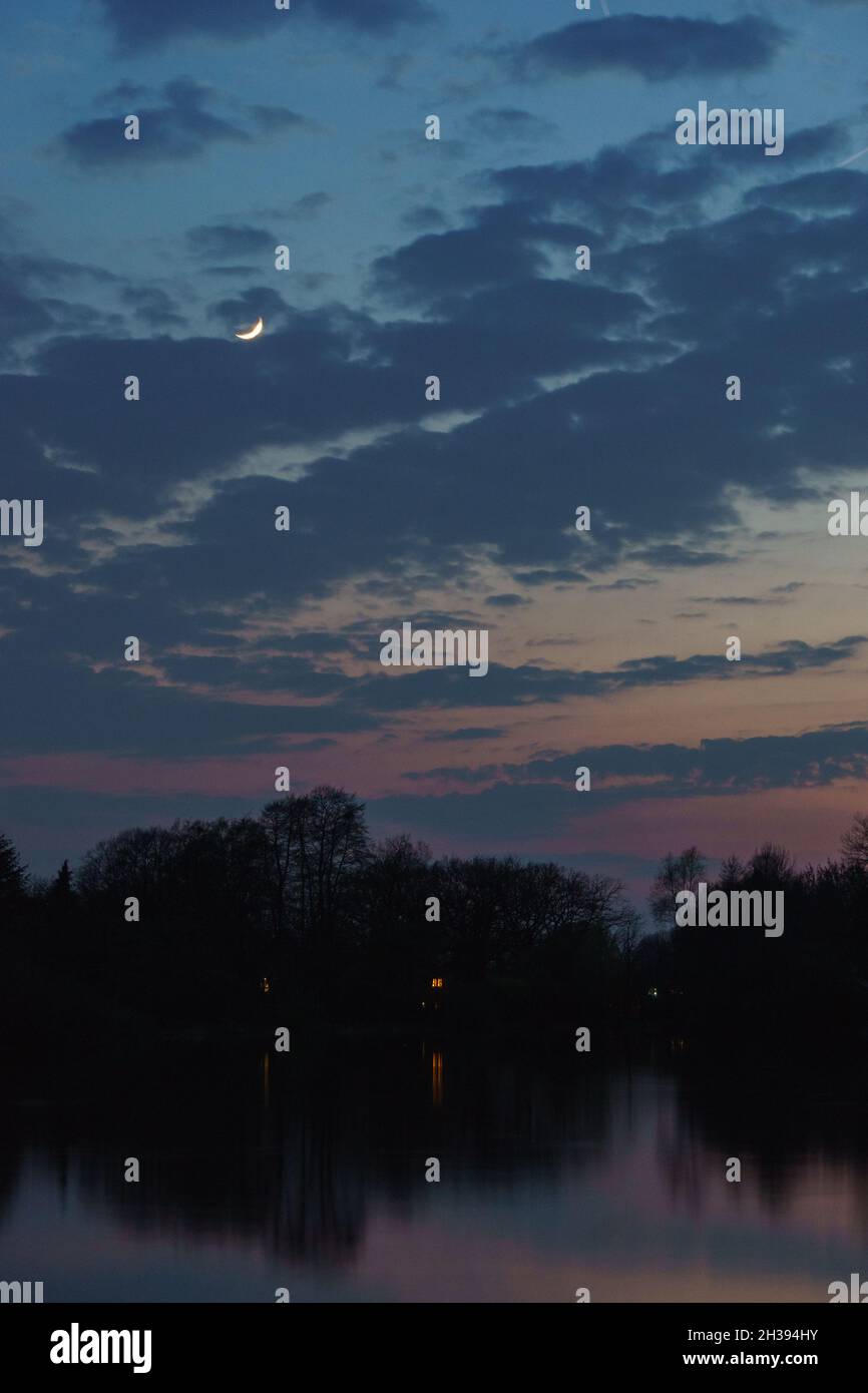 Crescent moon sunset clouds on hi-res stock photography and images - Alamy