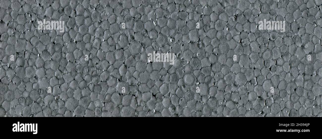 Grey round styrofoam background texture closeup detail, dark foam ...