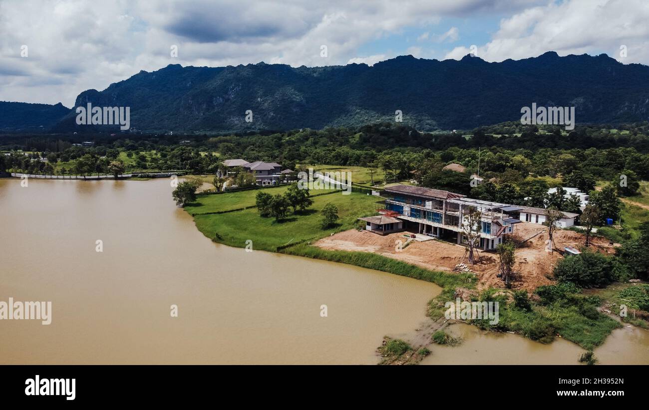 Aerial view of a small village located near the dirty lake Stock Photo ...