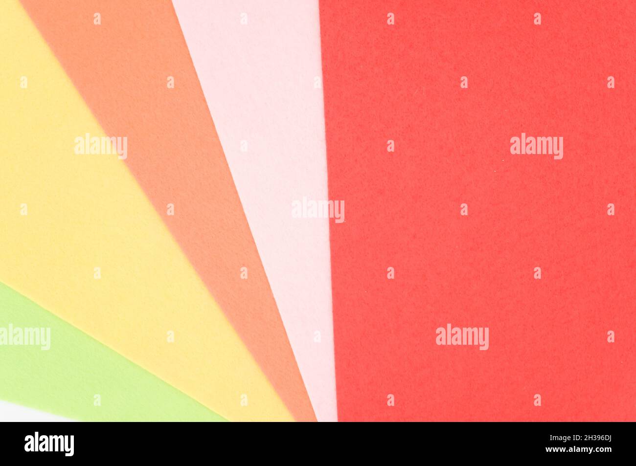 multicolored felt sheets backdrop on a white background Stock Photo - Alamy