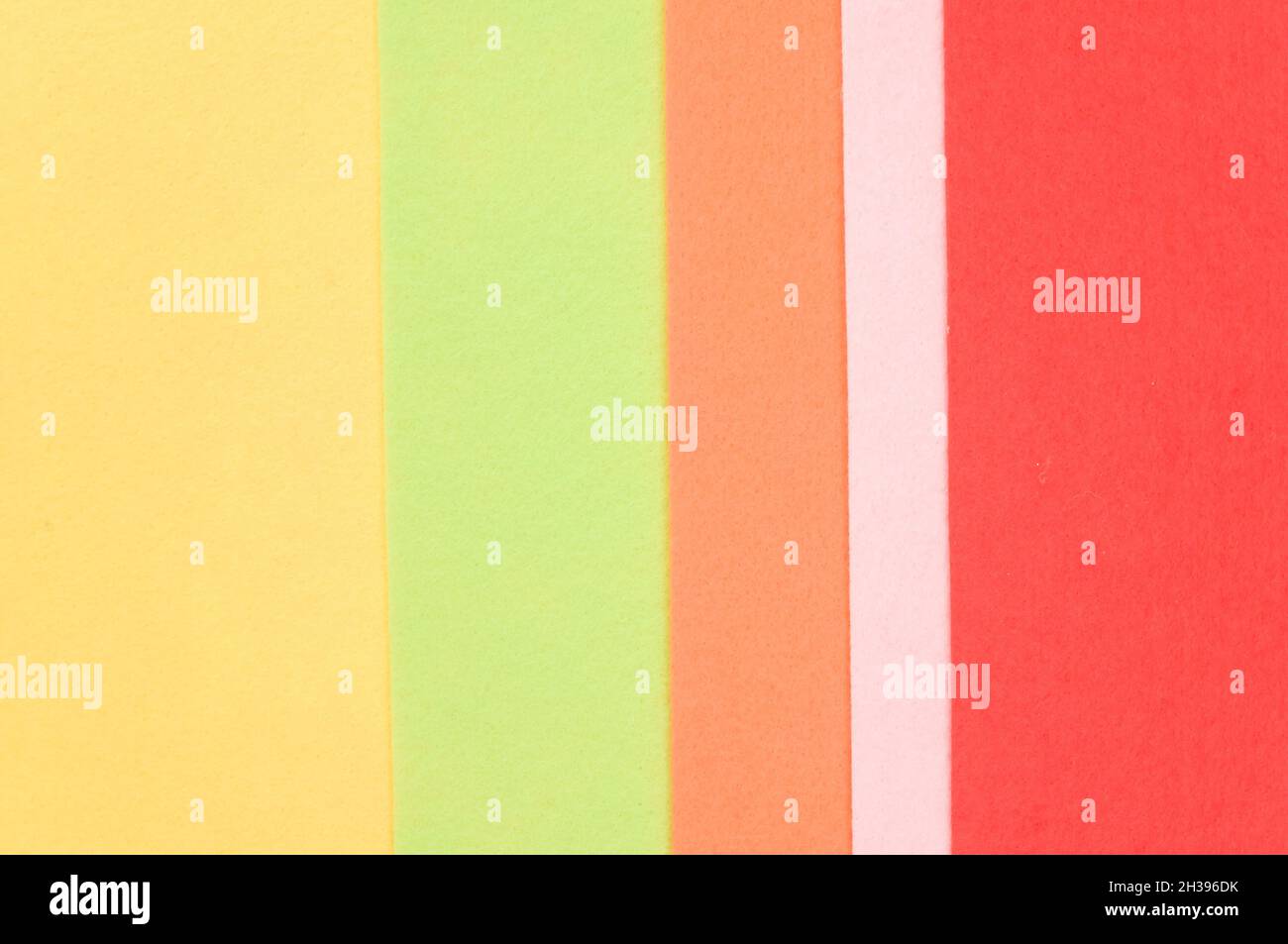 multicolored felt sheets backdrop on a white background Stock Photo - Alamy