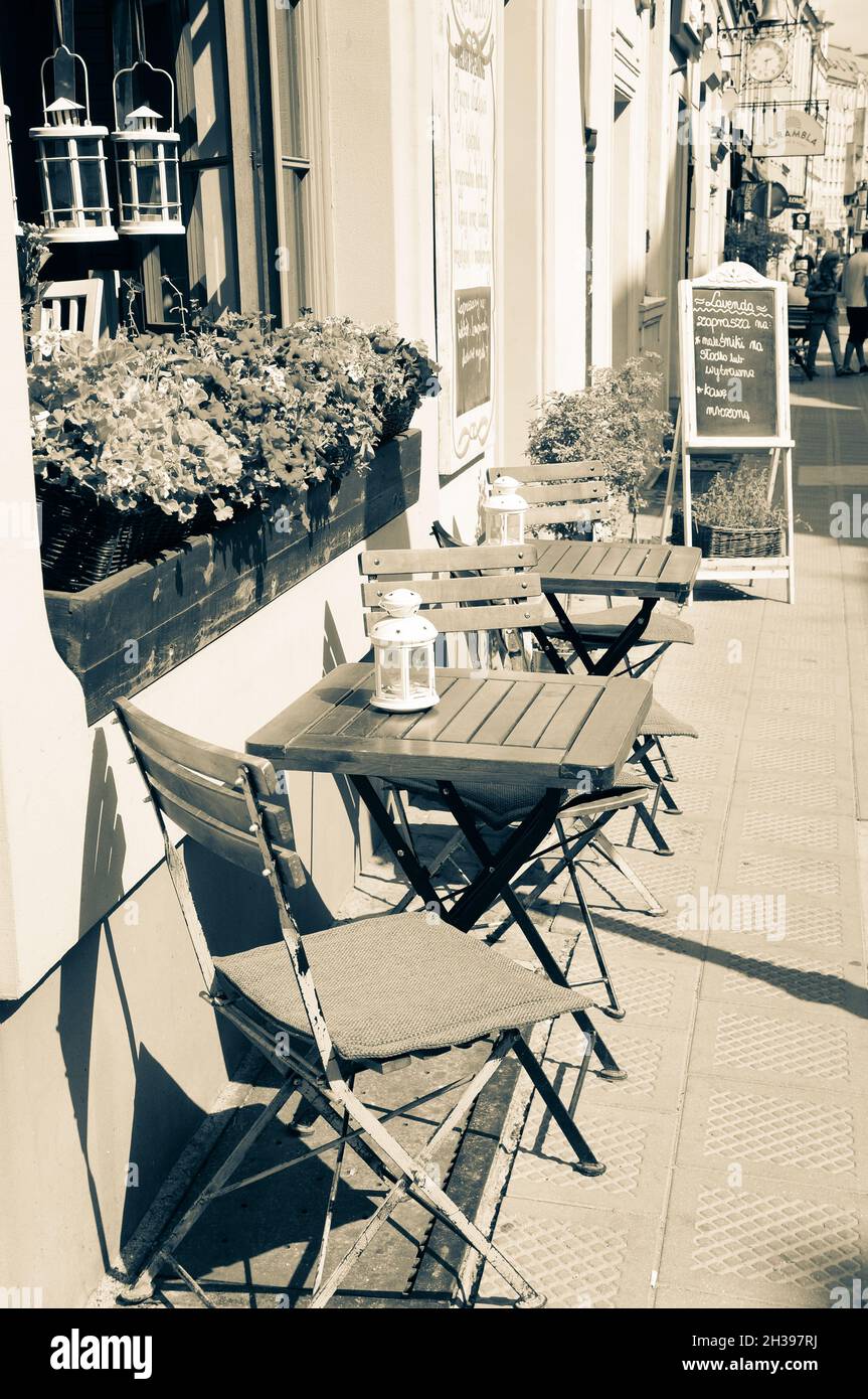 POZNAN, POLAND - Jul 12, 2016: A vertical shot of an outdoor cafe with ...