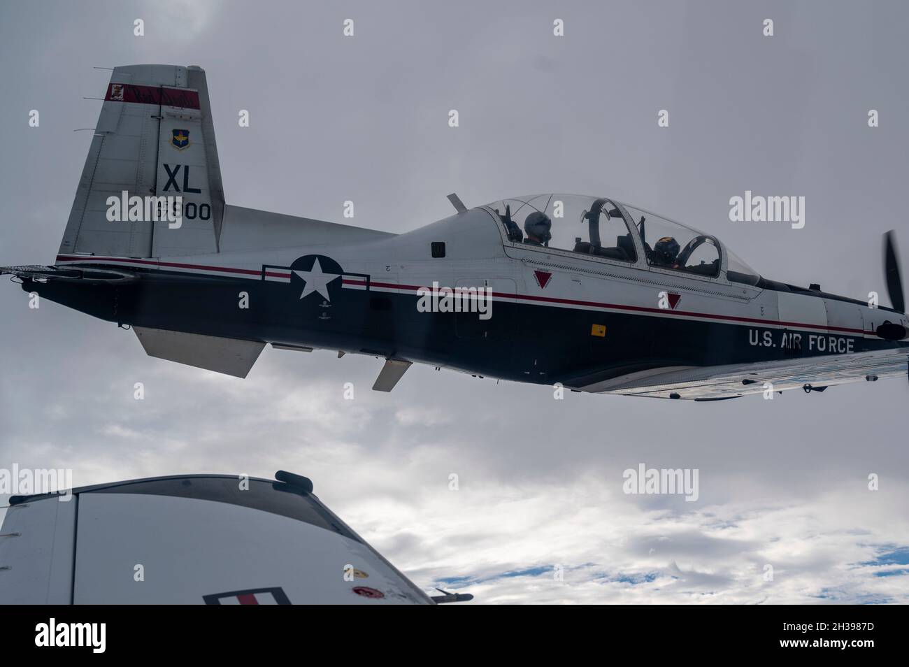 A Texan II T-6 fly’s though the air as it performs standard training ...