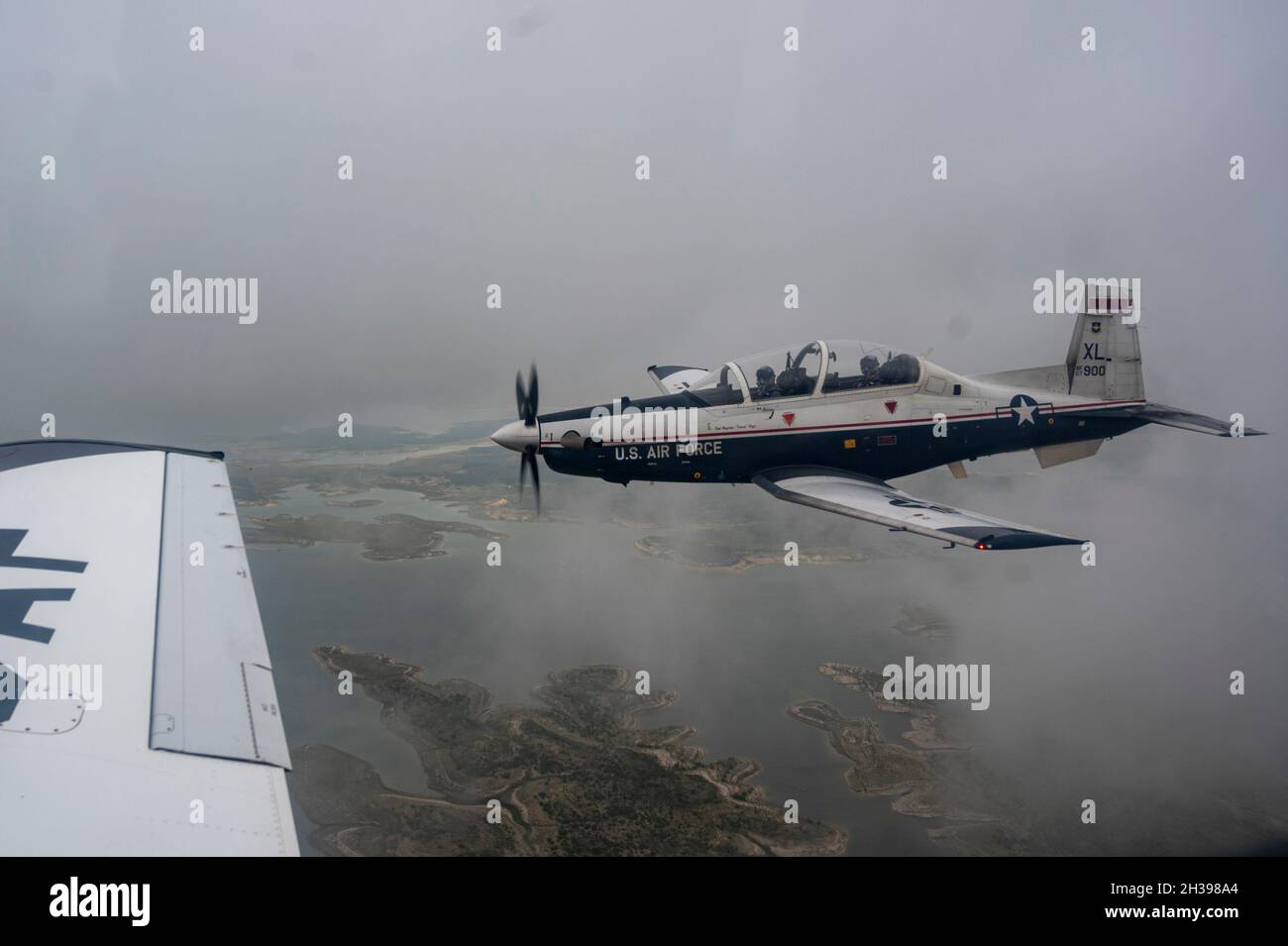 A Texan II T-6 fly’s though the air as it performs standard training ...