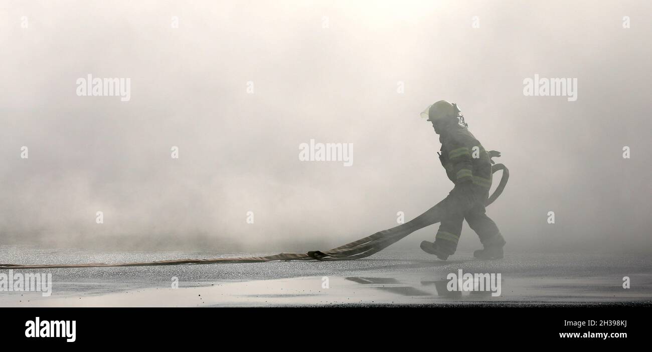 A firefighter with Logcap V Emergency Services Directorate (ESD) Fire ...