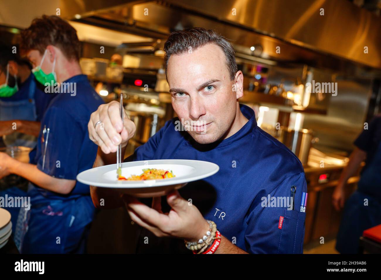Berlin, Germany. 26th Oct, 2021. Berlin top chef Tim Raue prepares a ...