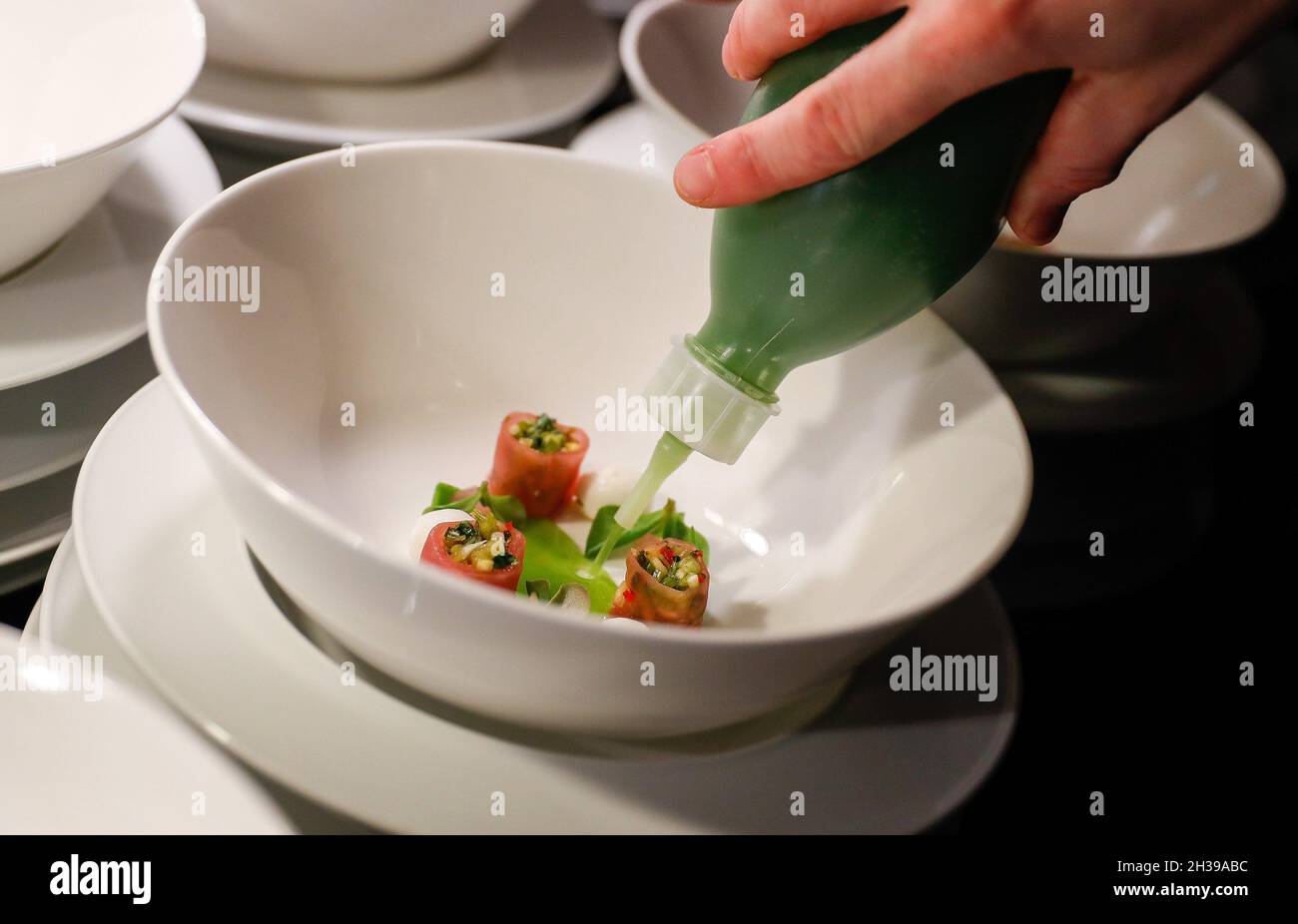 Berlin, Germany. 26th Oct, 2021. A chef prepares a dish at the ...