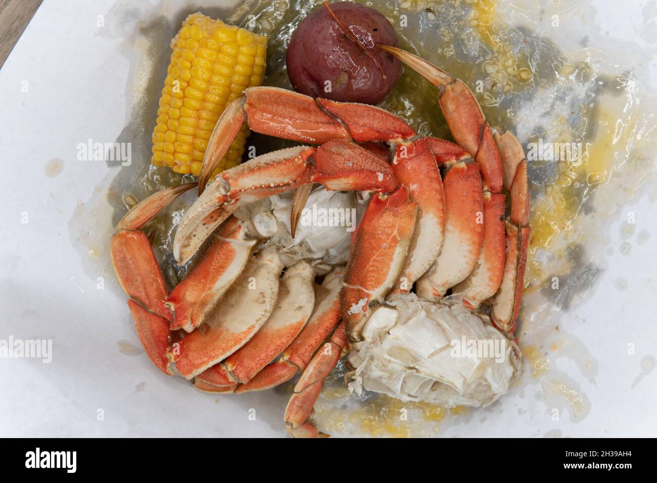 Overhead view of boiled pot of dungeness crab legs ready for the ...