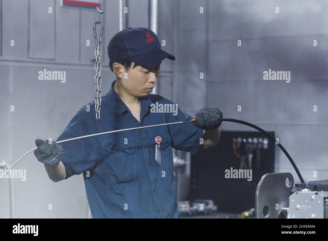 HANGZHOU, CHINA - OCTOBER 27, 2021 - An employee tests a newly produced ...