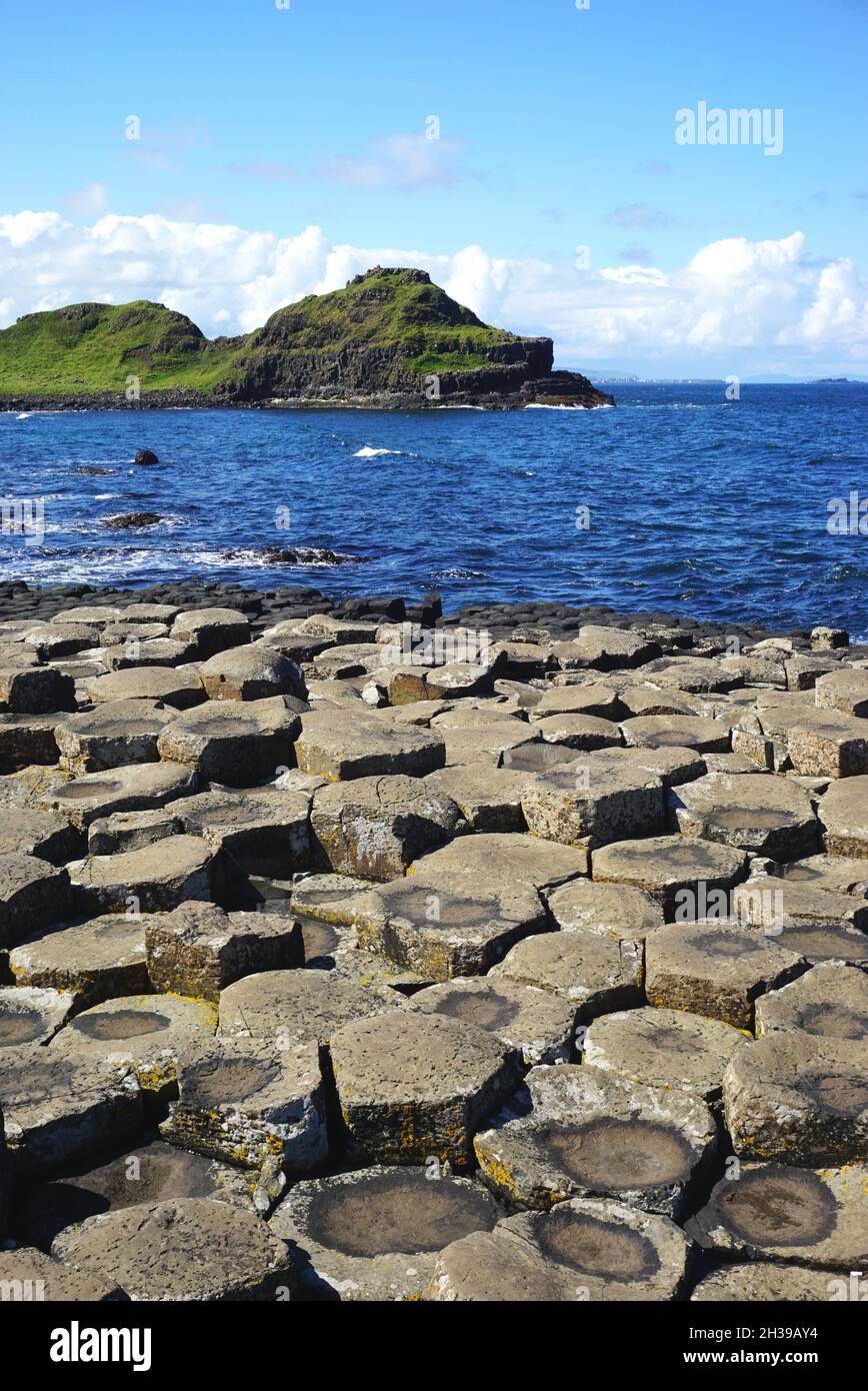 View of natural volcanic basalt rock formations with the sea beyond at ...