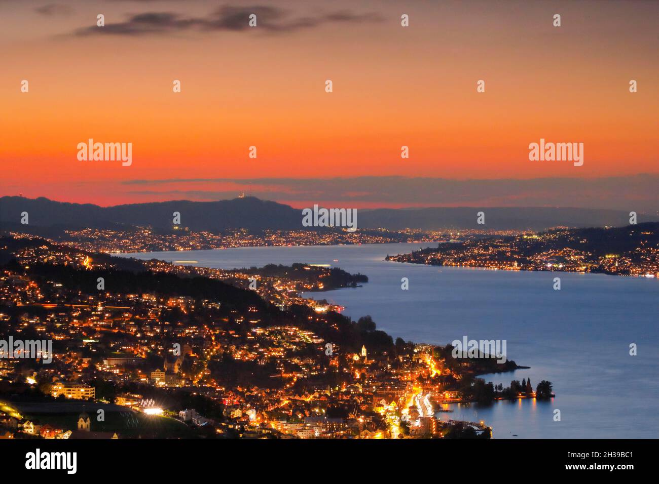 View at dusk from Feusisberg across Lake Zurich to Zurich, with the ...