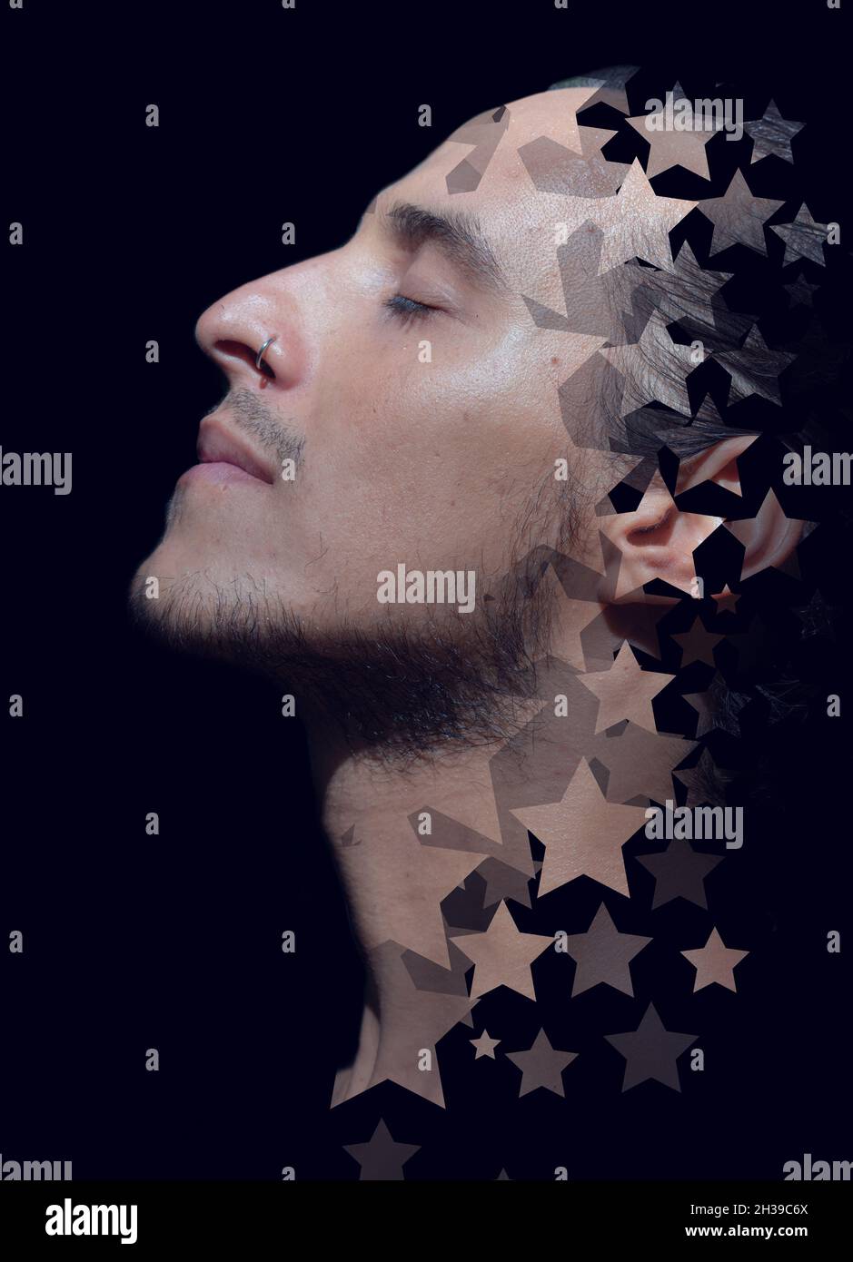 A portrait of a young male combined with multiple stars against a black ...