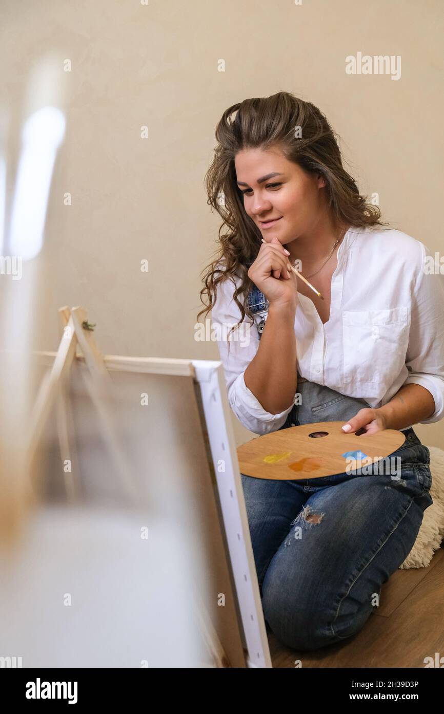 Creative painter in working process. Artist workplace, hobby, craft ...