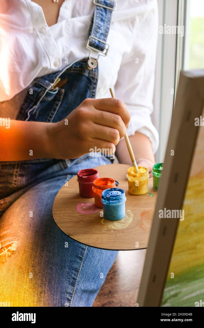 Creative painter in working process. Artist workplace, hobby, craft ...