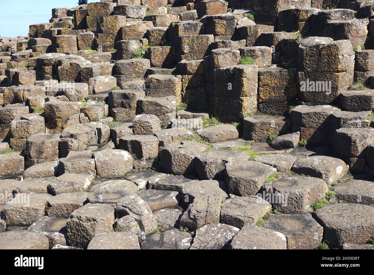 View of ancient volcanic basalt columns with geometric shapes at the ...