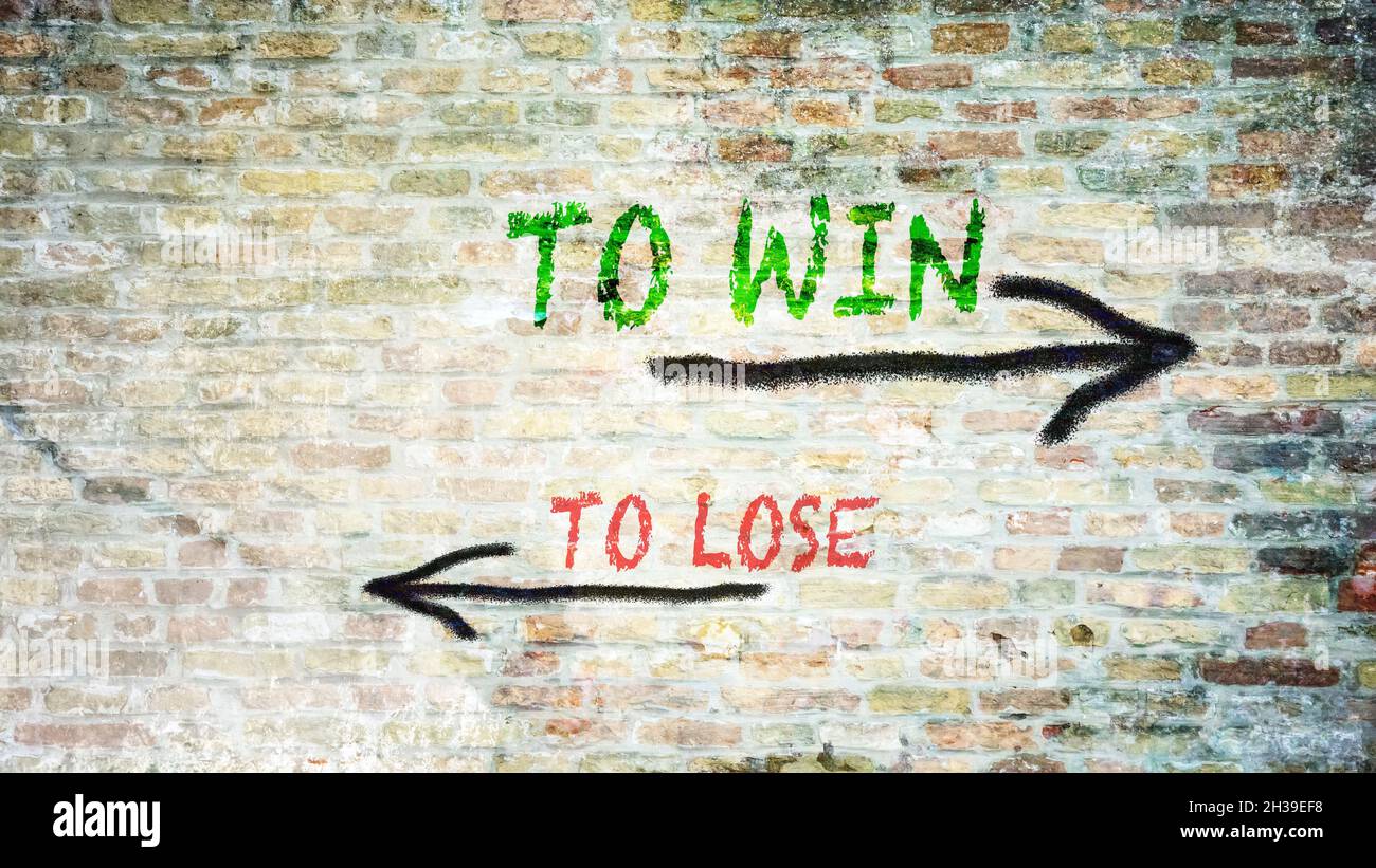 Street Sign the Direction Way TO WIN versus TO LOSE Stock Photo - Alamy