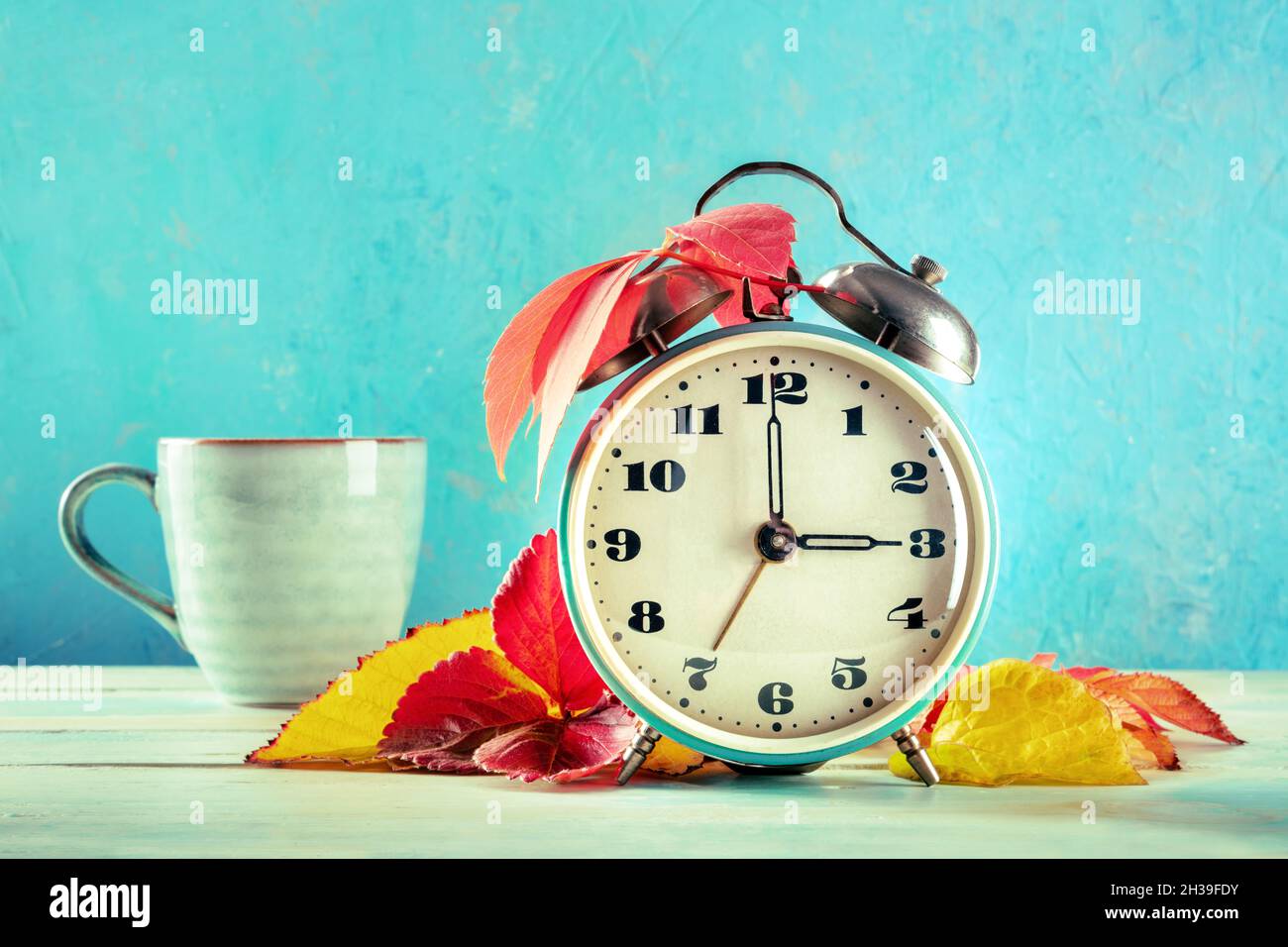 Daylight Saving Time concept, fall back in autumn. A vintage alarm ... Daylight Saving Time concept, fall back in autumn. A vintage alarm ...