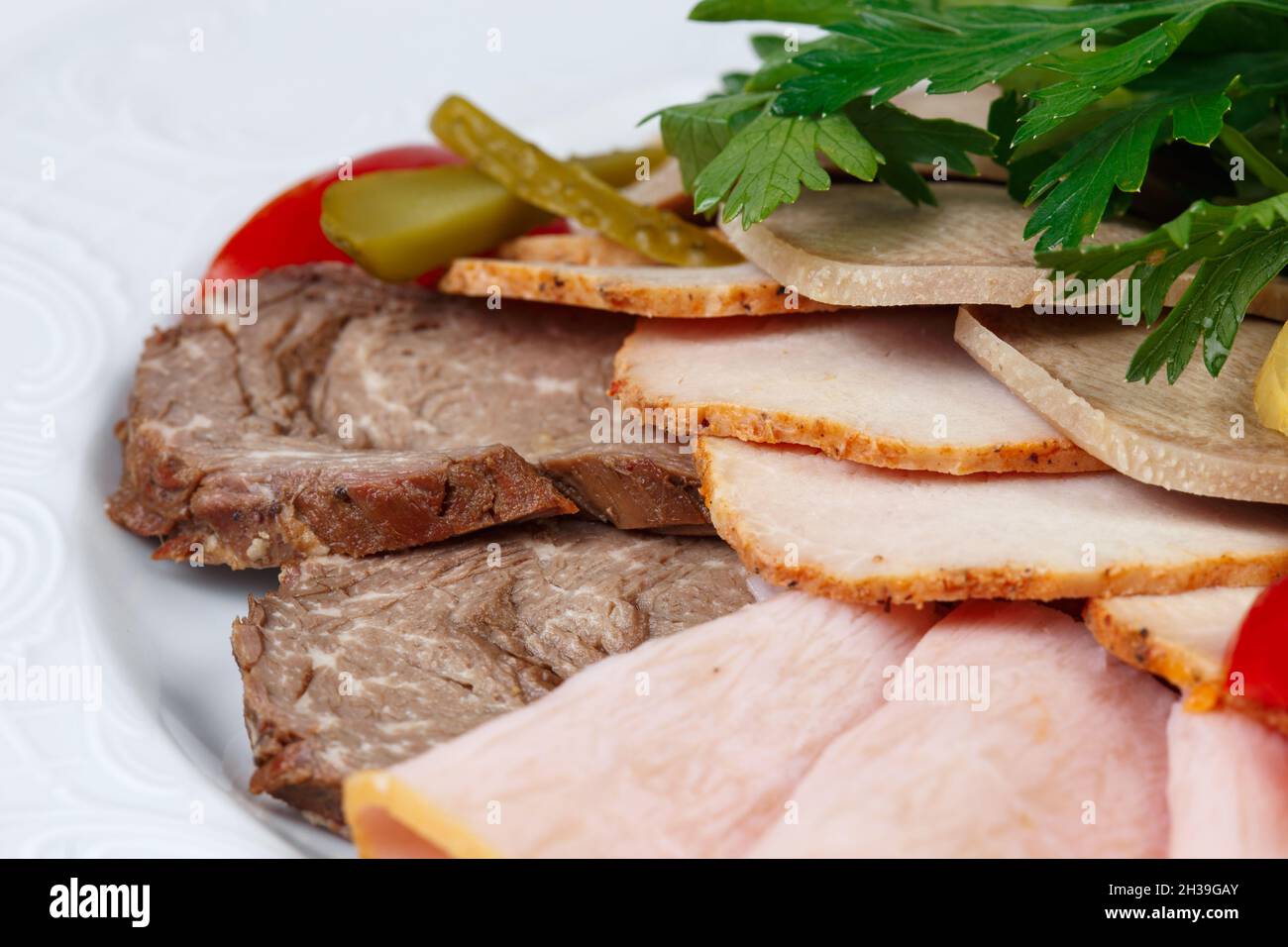 Close-up photo of meat snacks on plate on white background Stock Photo ...