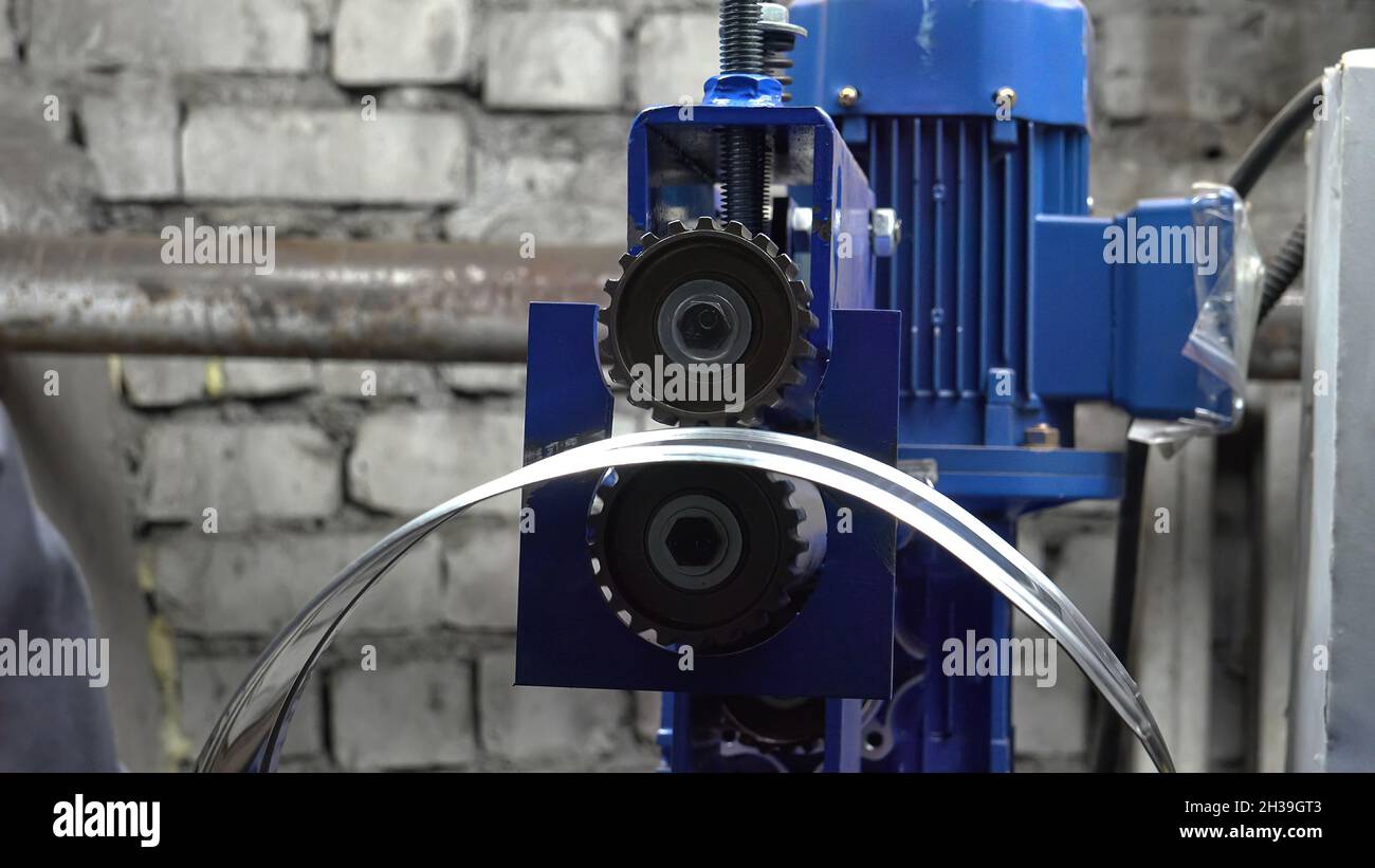 Photo of the working metal's corrugated machine Stock Photo - Alamy