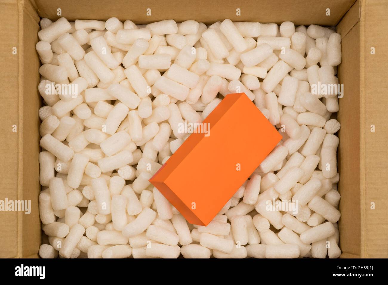 Cardboard box with styrofoam filler for safe packaging. Gift package ...