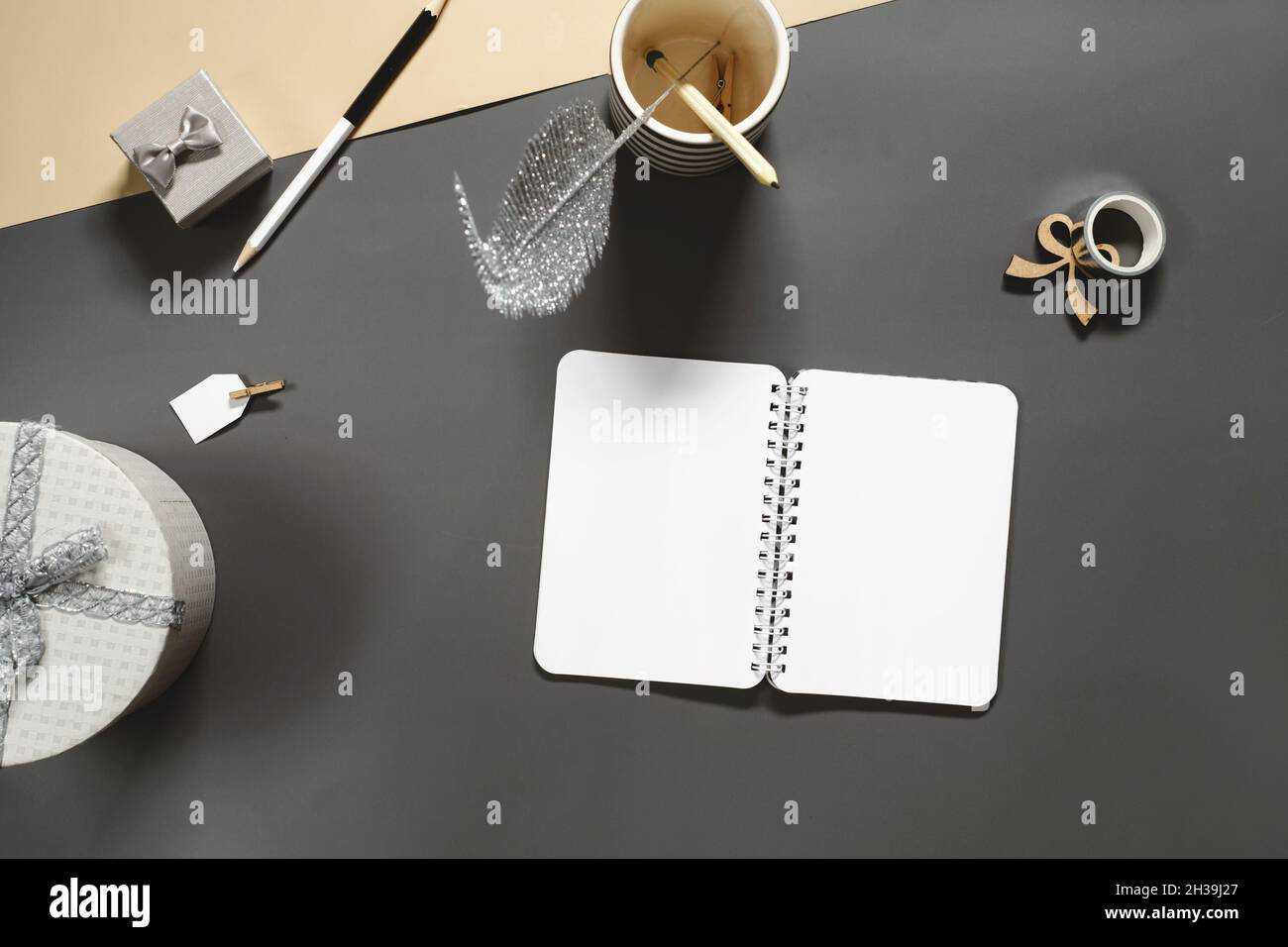 Opened empty note book for New Year wishes and resolutions on dark grey ...
