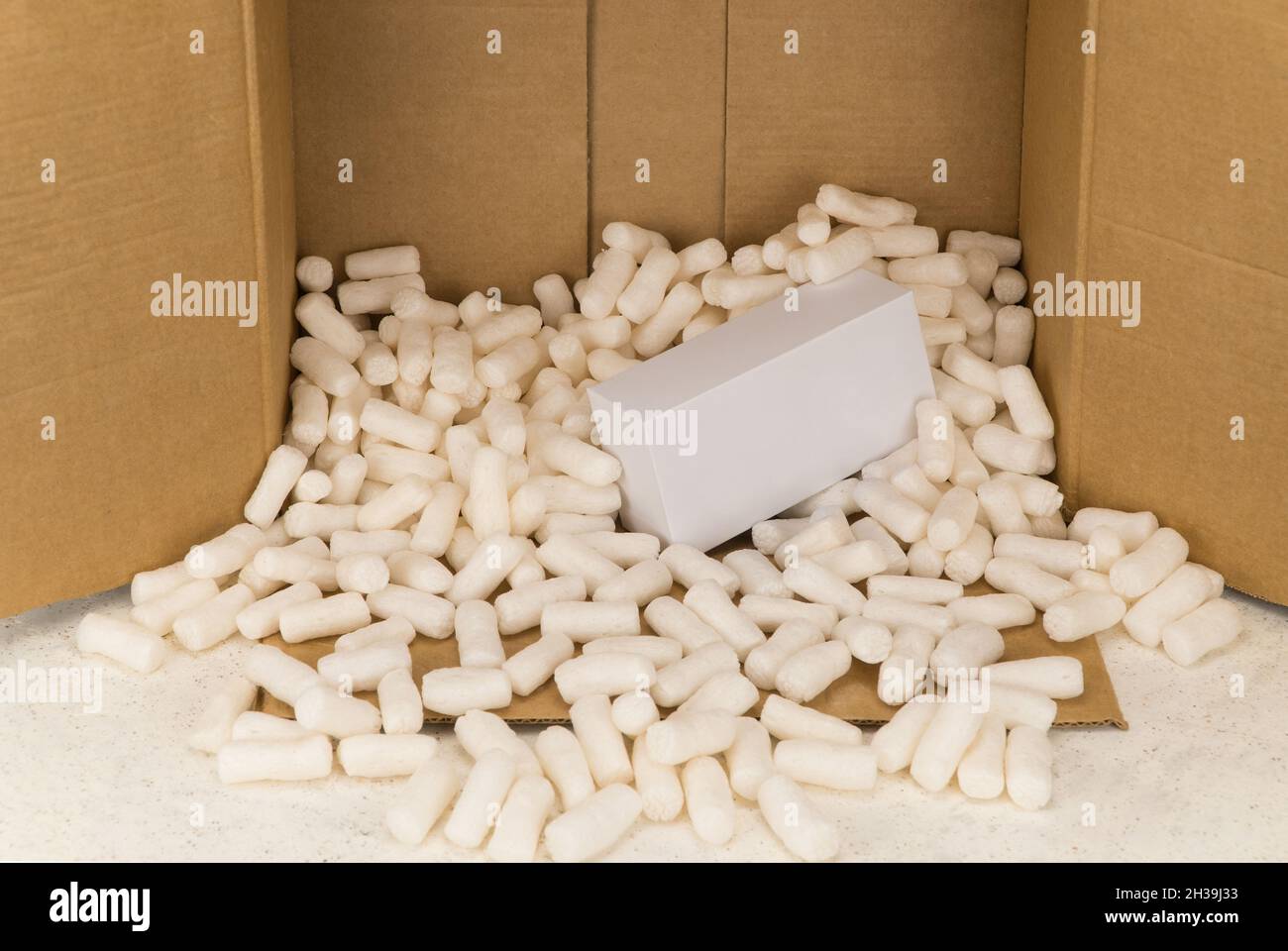 Cardboard box with styrofoam filler for safe packaging. Gift package ...