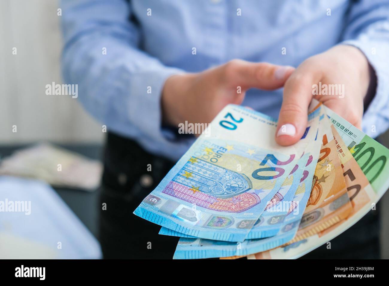 Business Woman Displaying a Spread of Cash euros. Close-up. Income and ...